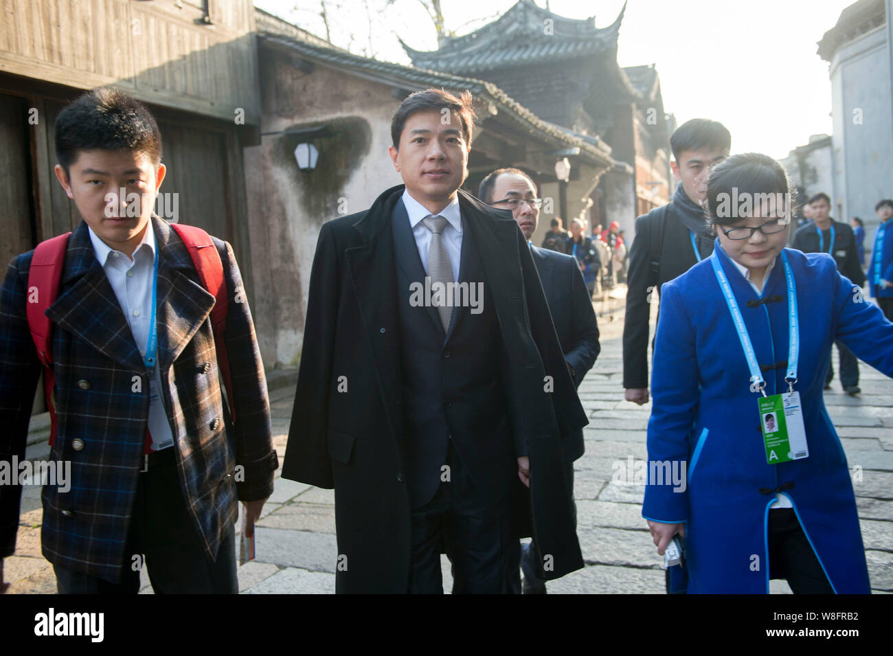 Robin Li Yanhong, center, Chairman of Baidu, arrives for the opening ...