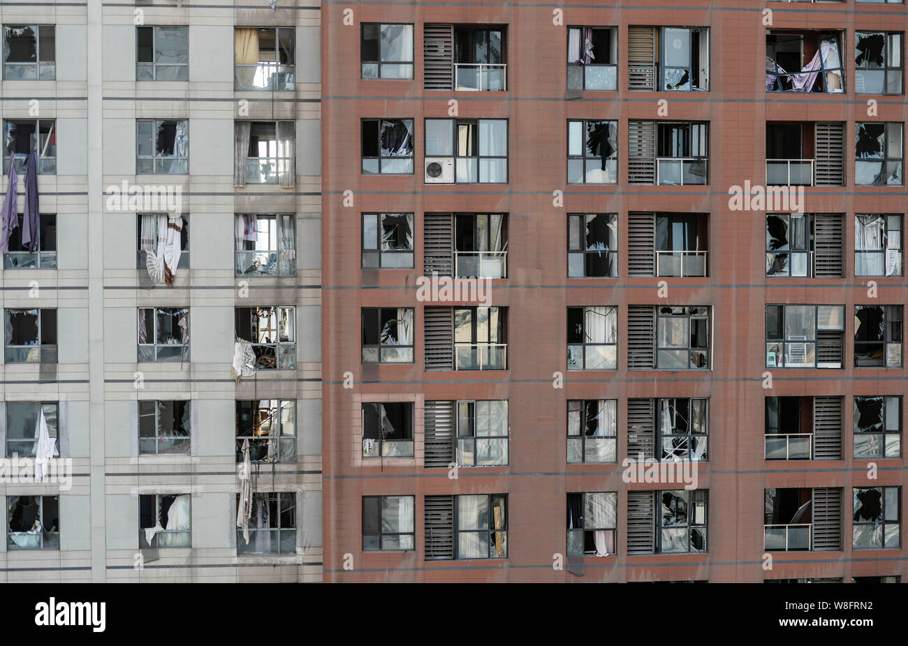 --FILE--Windows are broken on a high-rise residential apartment ...
