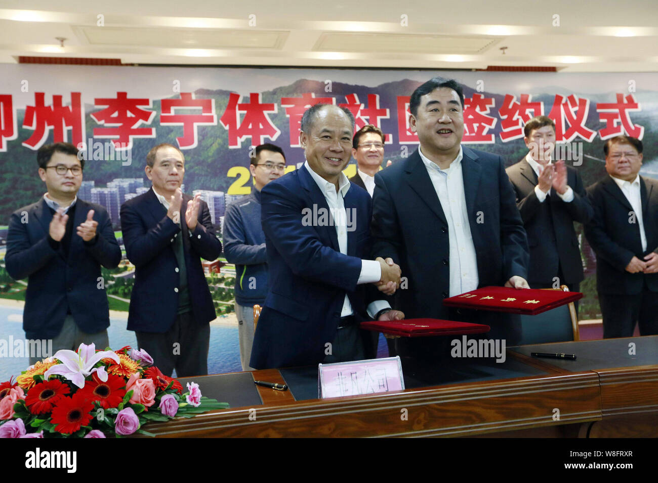 Former Olympic gymanstics champion Li Ning, front left, chairman of Li ...