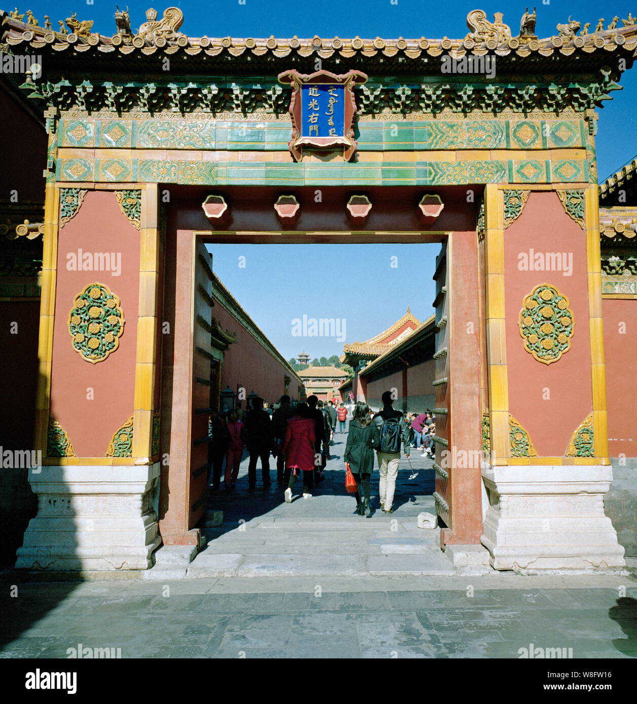 Tourists enter a gate in the Palace Museum, also known as the Forbidden ...