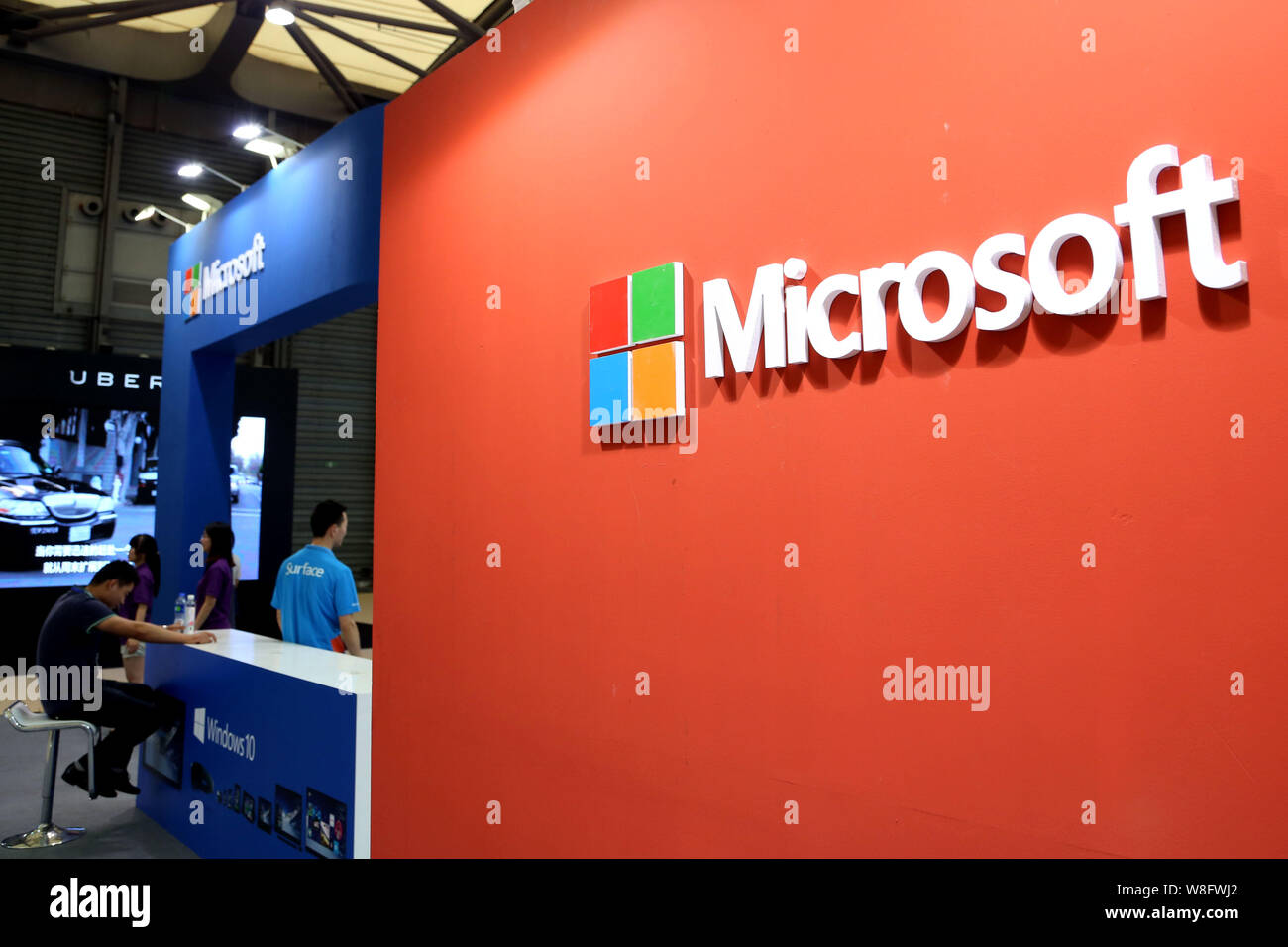 --FILE--People visit the stand of Microsoft during an exhibition in ...