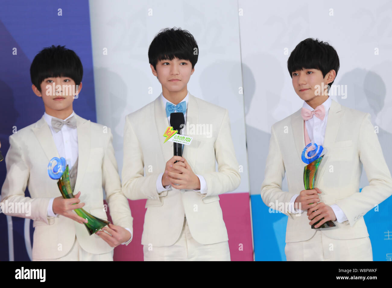 Chinese boy group TFBOYS pose with their trophies during the 22th ...