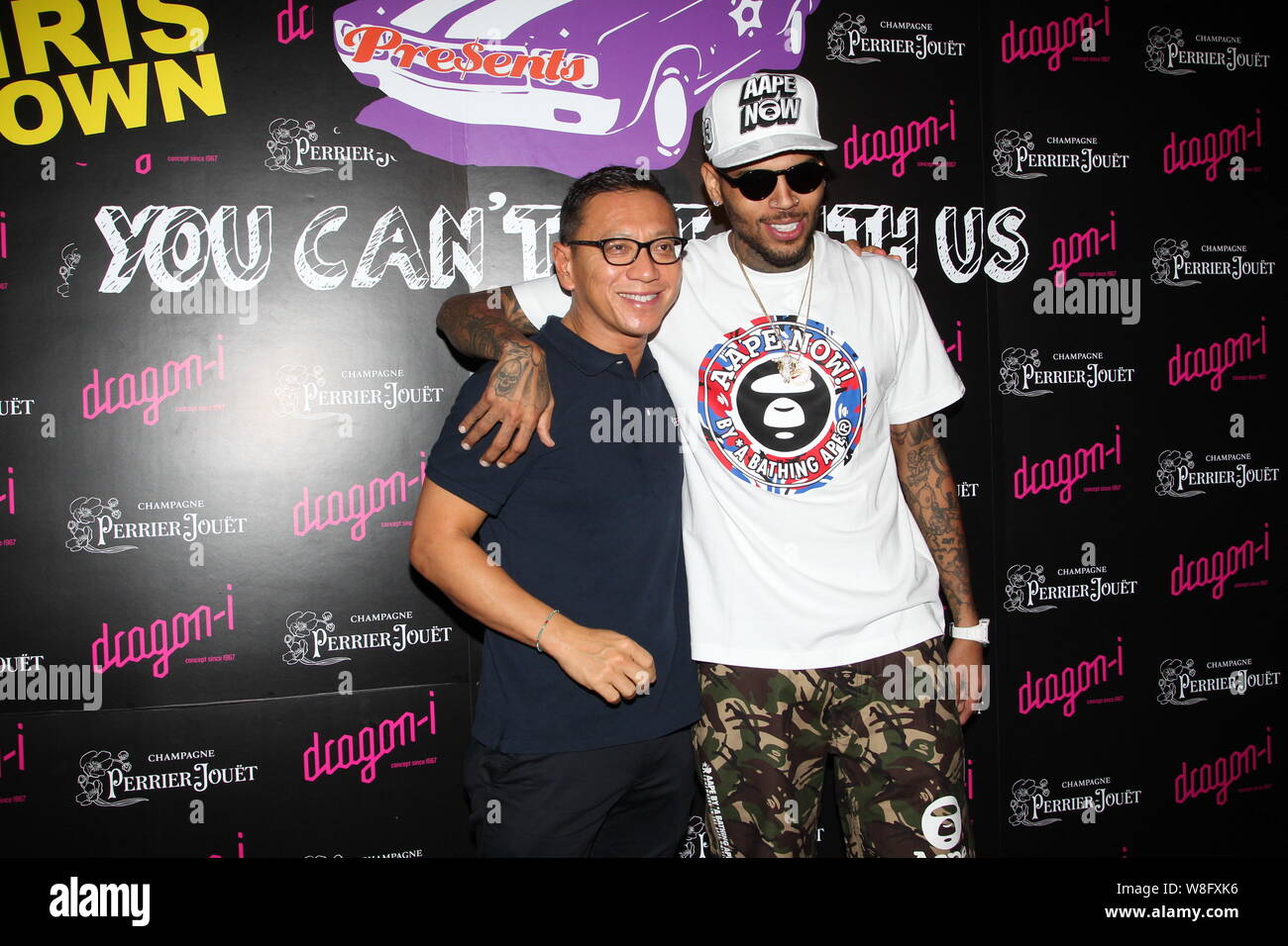 American singer and actor Chris Brown, right, poses with Gilbert Yeung ...