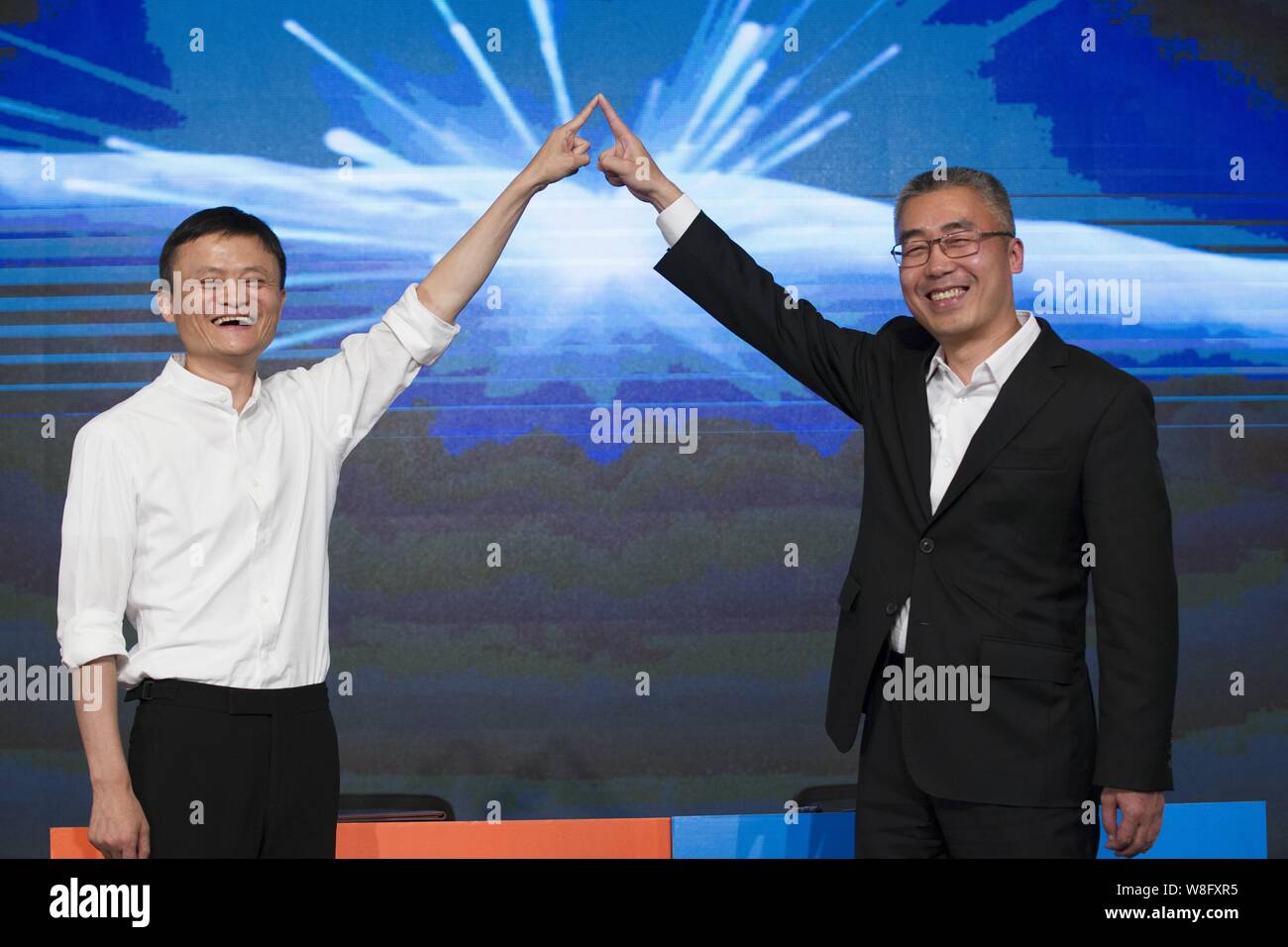 Jack Ma Yun, left, Chairman of Alibaba Group, and Li Ruigang, Chairman ...