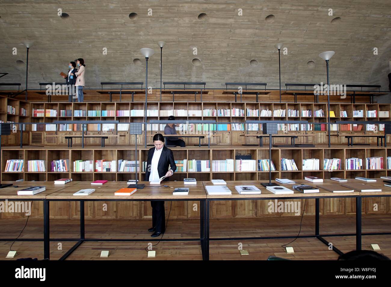 Readers are seen at an isolated library that lies hundreds of meters ...