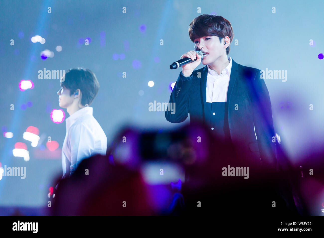 Members of South Korean pop group Super Junior perform during their ...