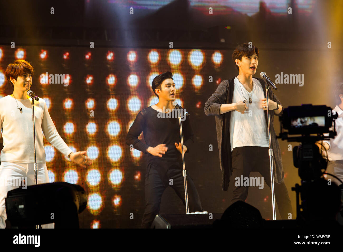 Members of South Korean pop group Super Junior perform during their ...