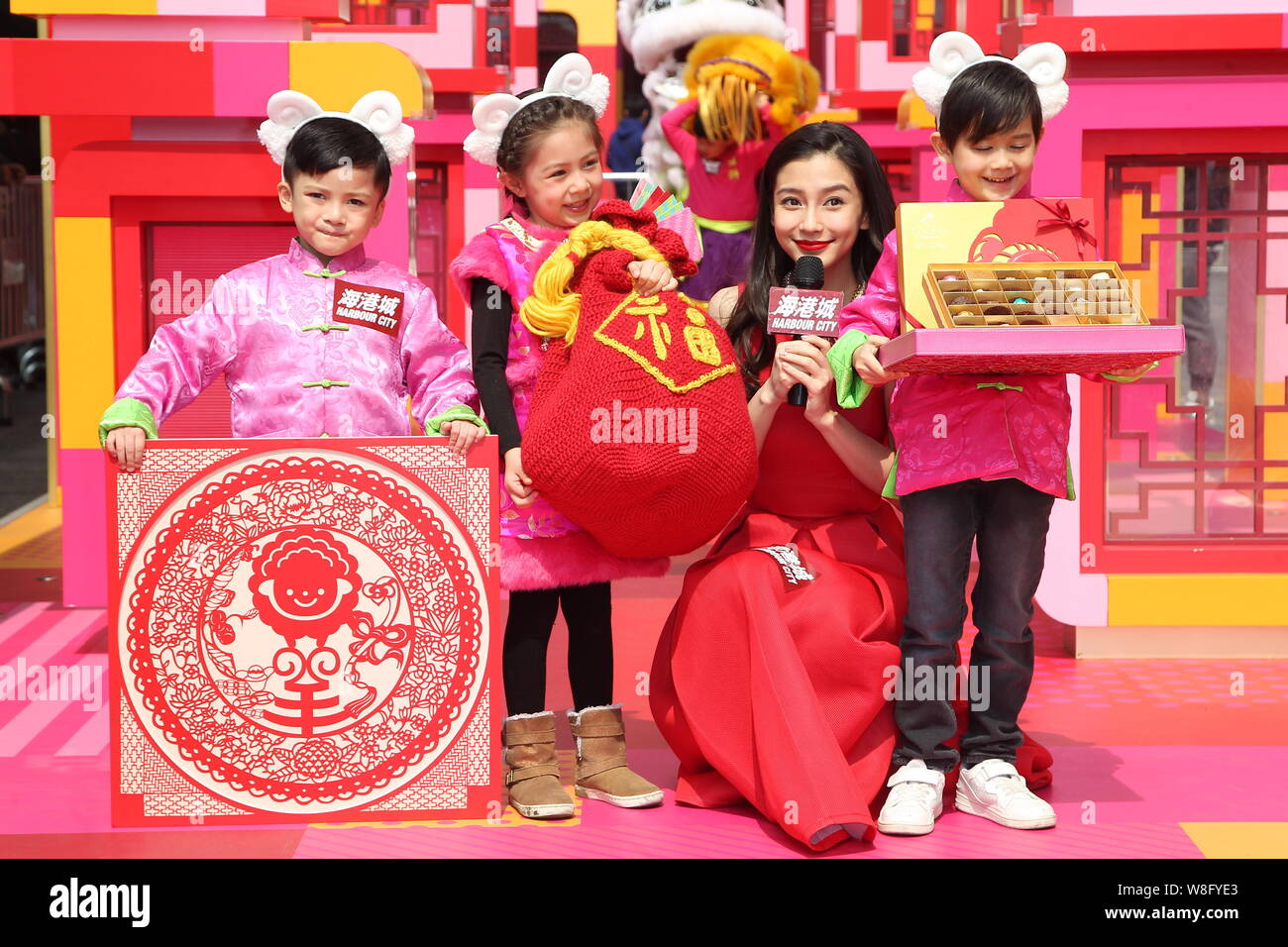 Hong Kong model and actress Angelababy, second right, poses with ...