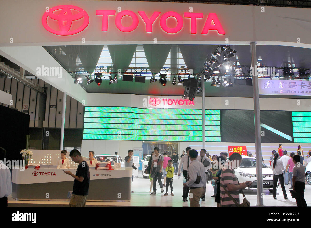 --FILE--People visit the stand of Toyota during an auto show in Nanjing ...