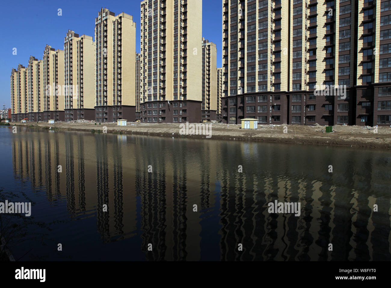 --FILE--Newly-built high-rise residential apartment buildings are ...