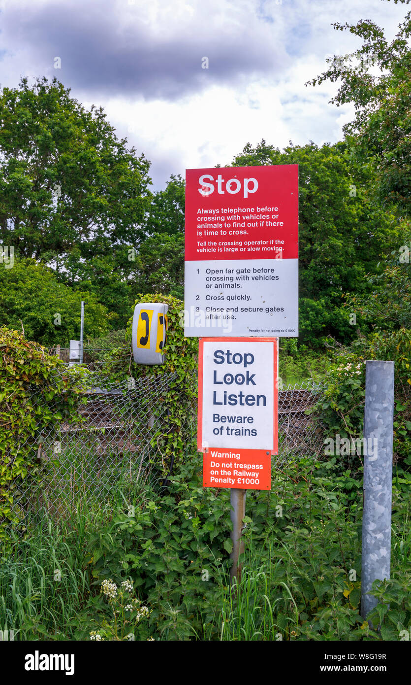 Train warning signs at an unmanned country railway line level crossing ...