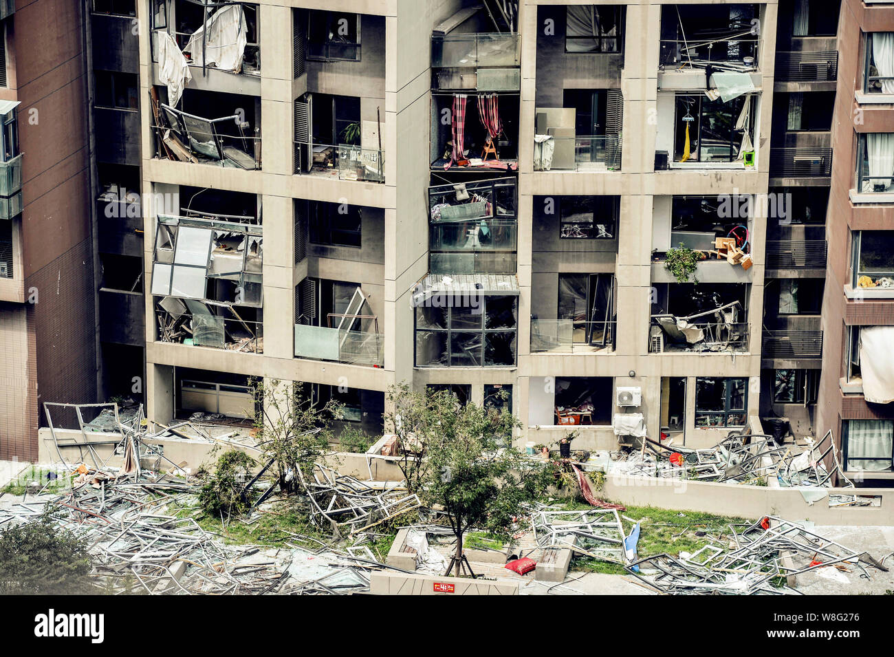 --FILE--Windows are broken on a high-rise residential apartment ...