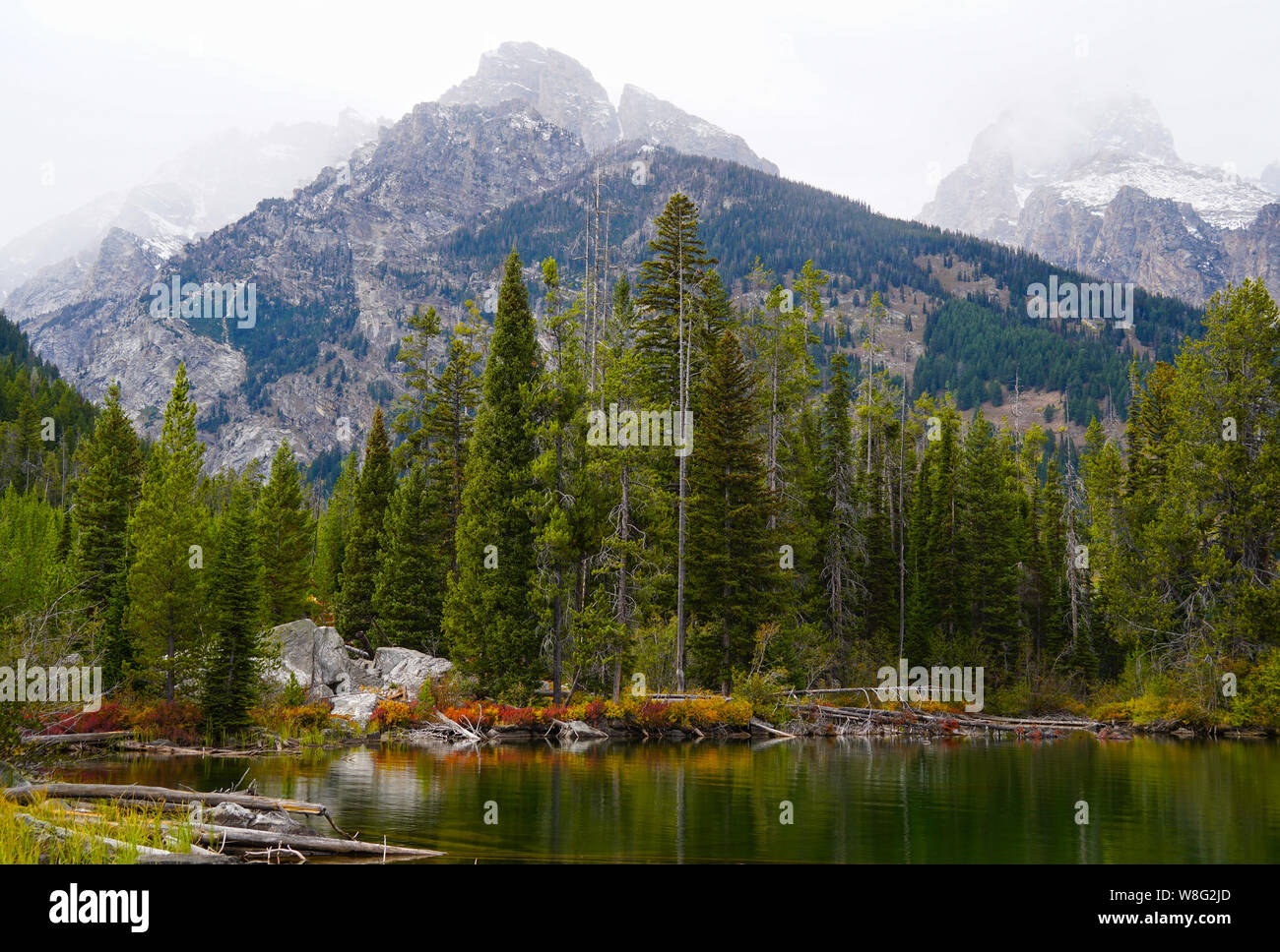 Fall on the lake with an approaching storm Stock Photo - Alamy