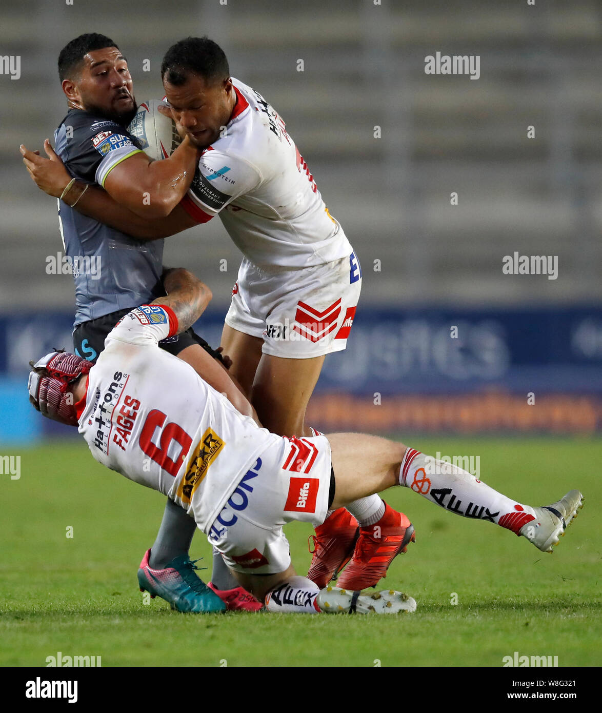 Wakefield Trinity's Kelepi Tanginoa (left) is challenged by St Helens ...