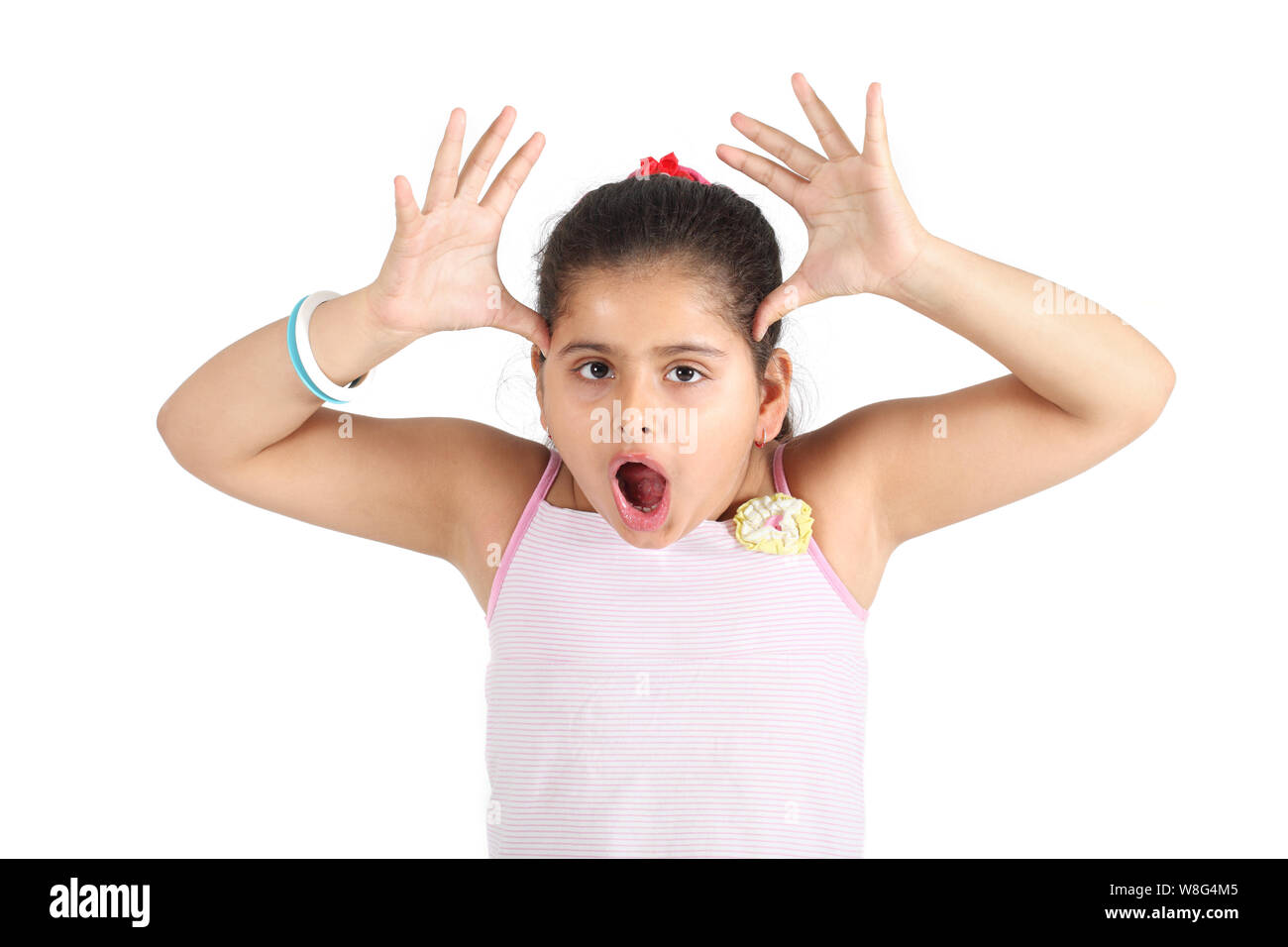 Girl making a face and smiling Stock Photo - Alamy