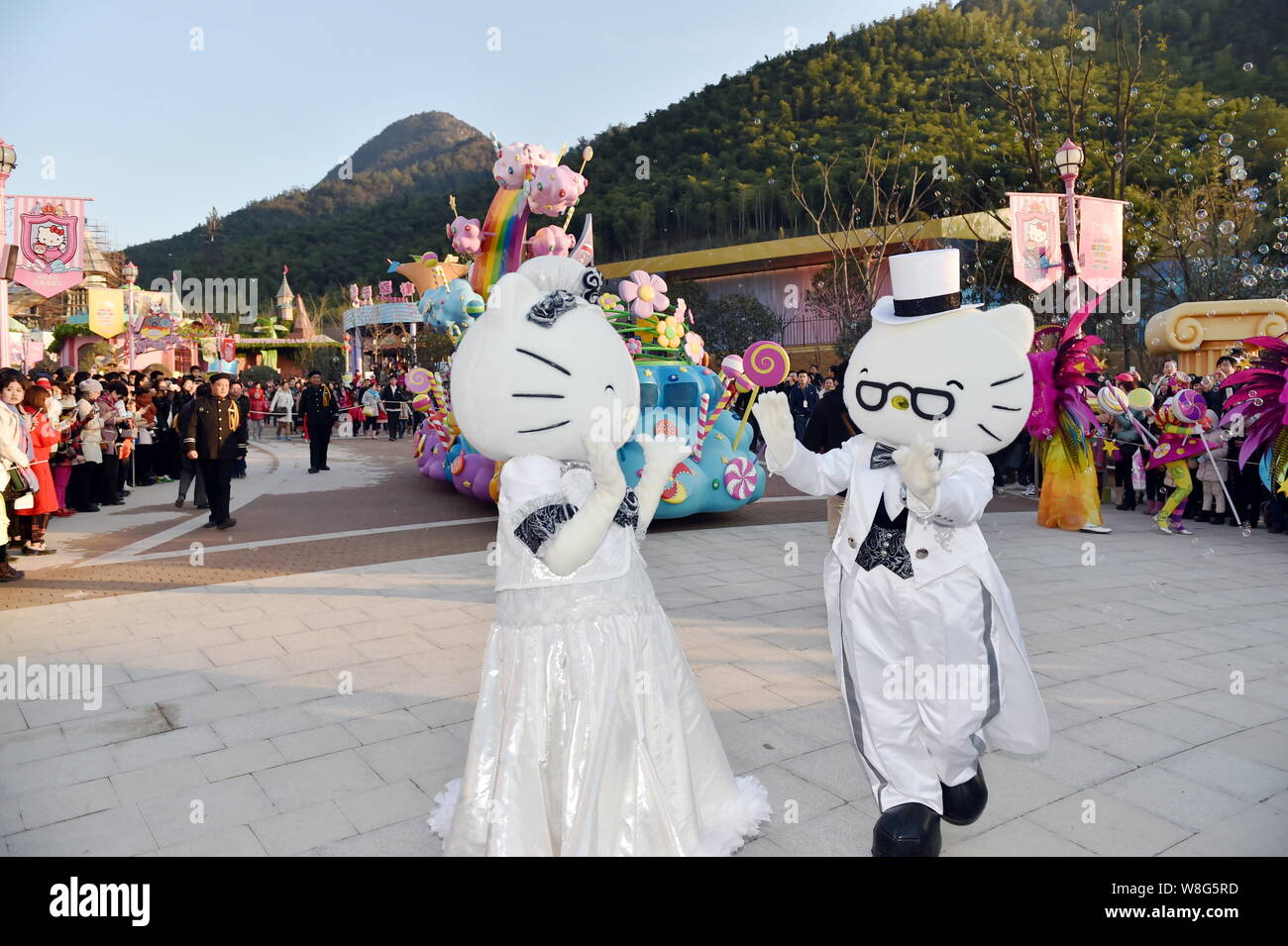 Entertainers dressed in Hello Kitty costumes parade at the Hello Kitty ...