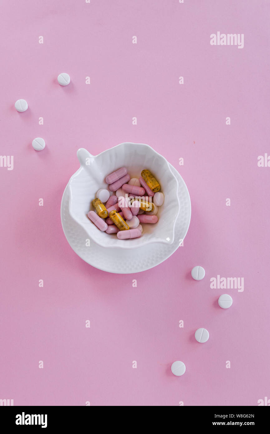 Pills in the dish. Concepts - what we eat, hidden ingredients ...