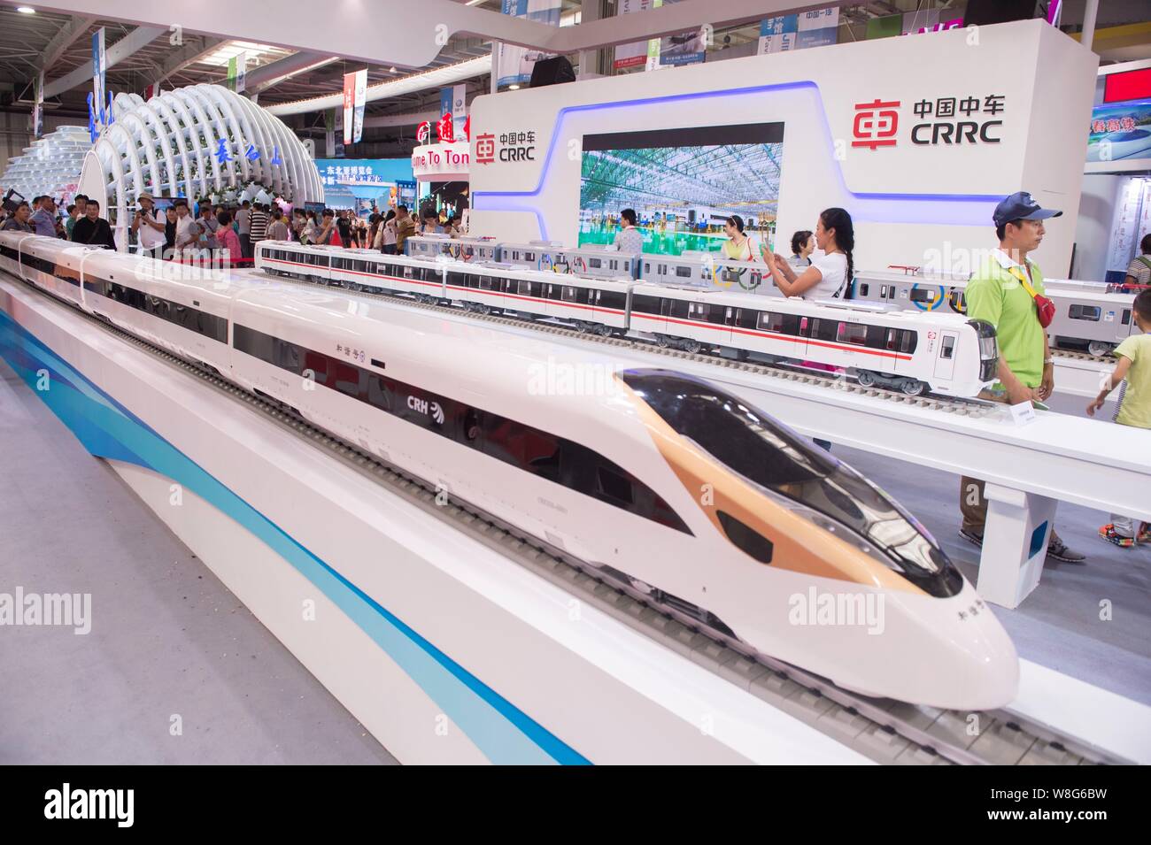 --FILE--Visitors look at models of a CRH (China Railway High-speed ...