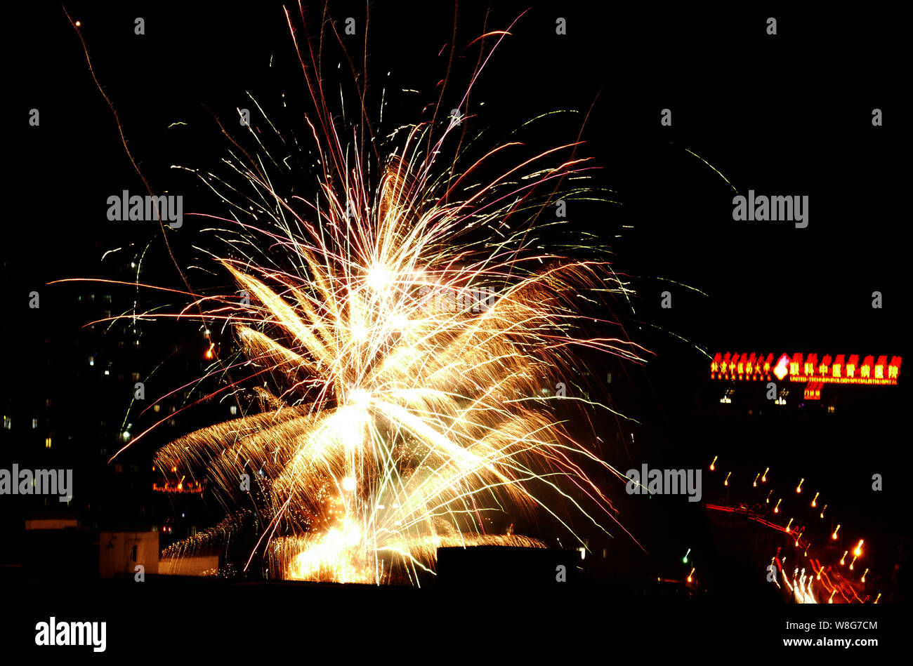 Fireworks explode over a residential area for Spring Festival to ...