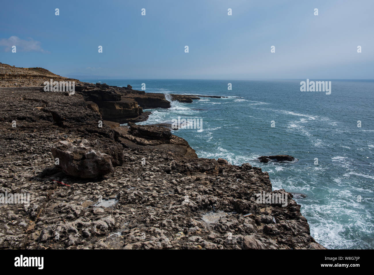 Ocean waves breaking against the rocks in a summer day Stock Photo - Alamy