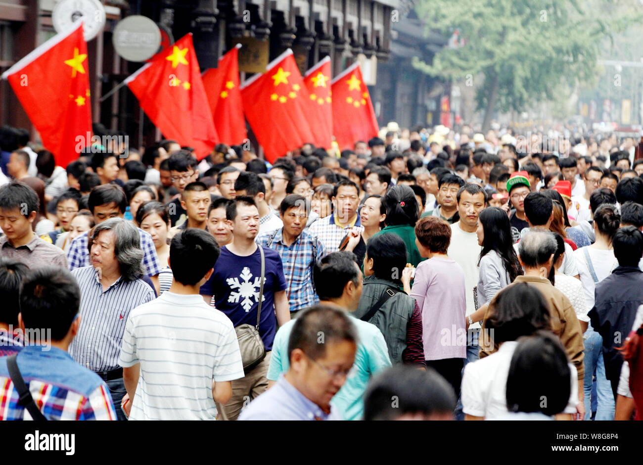 --FILE--Tourists crowd a street near the Confucius Temple during the ...