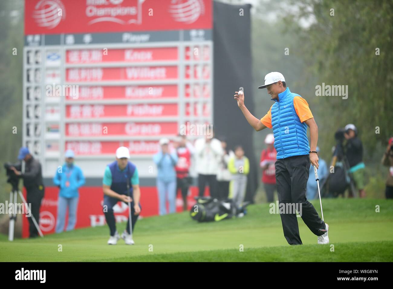 Chinese golfer Li Haotong reacts after finishing a putt during the ...