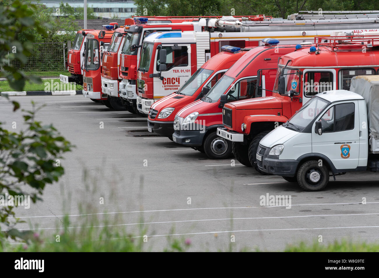 Many different red fire engine (fire trucks) of EMERCOM of Russia stand ...