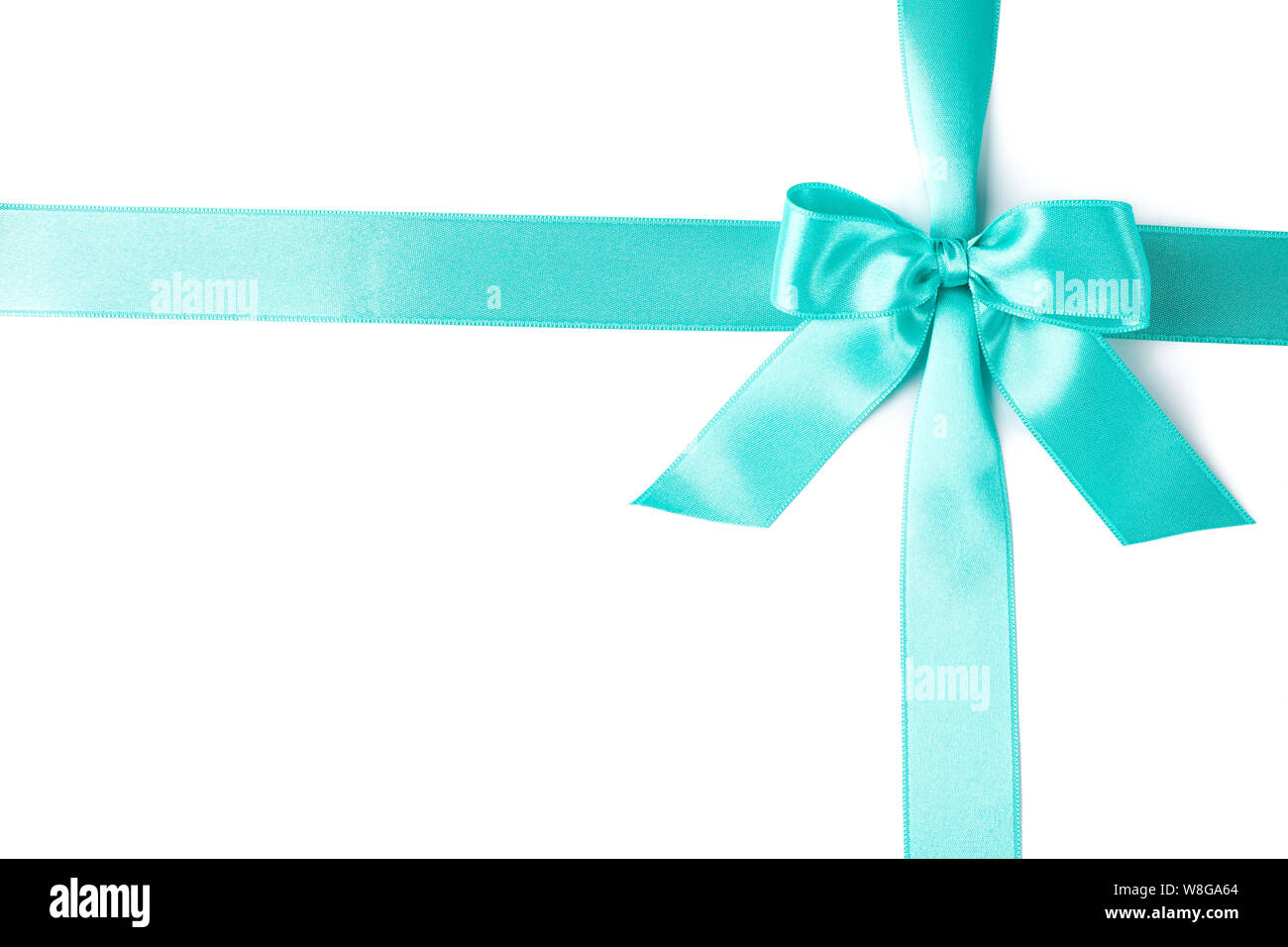 Turquoise ribbon with bow isolated on white background. Gift concept ...