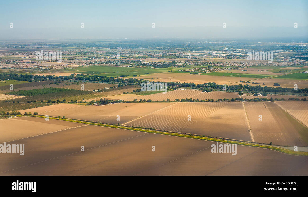 Aerial view of the Sacramento River, dense line of trees, with ...