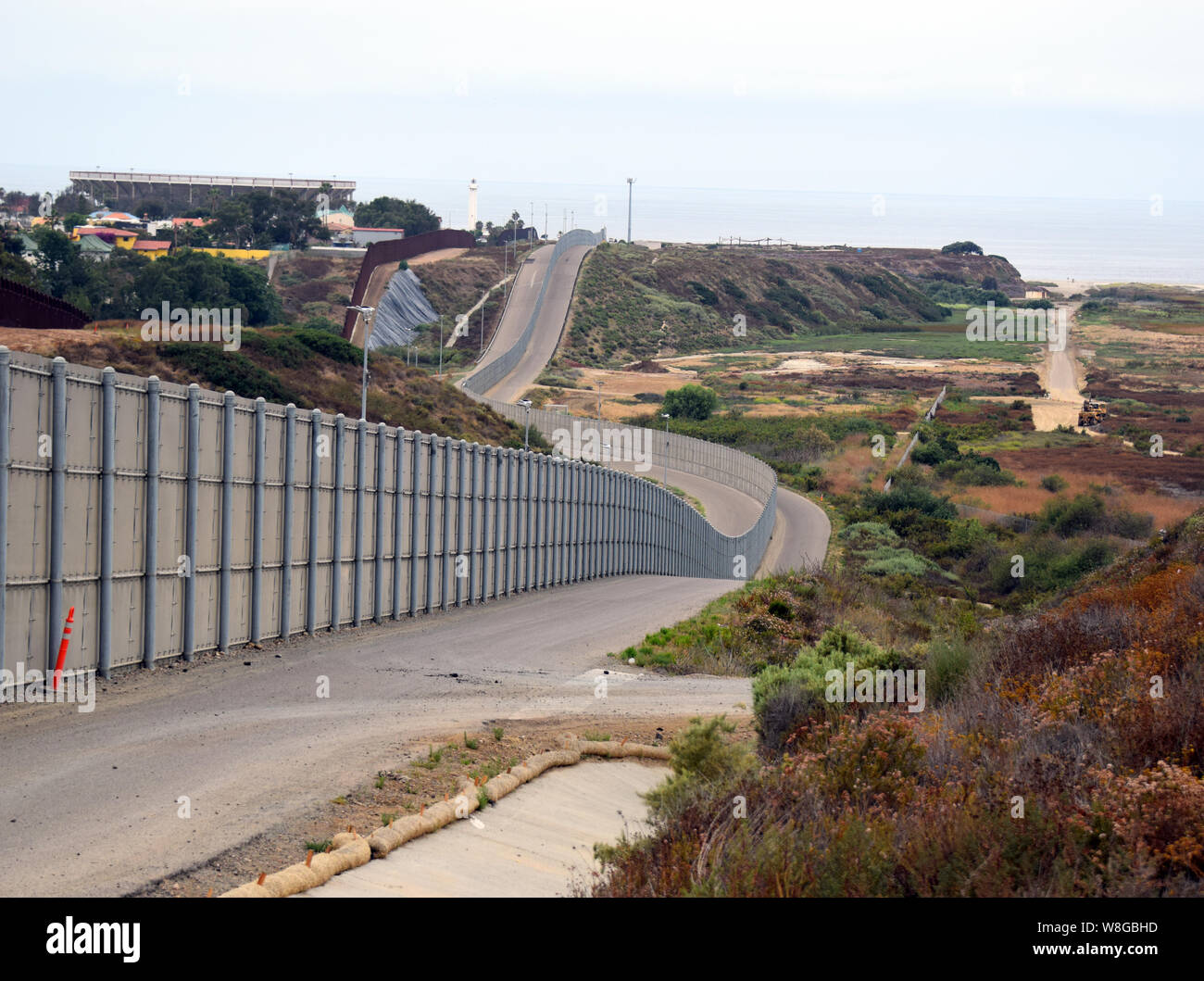 The San Diego secondary (foreground) and primary barriers run toward ...
