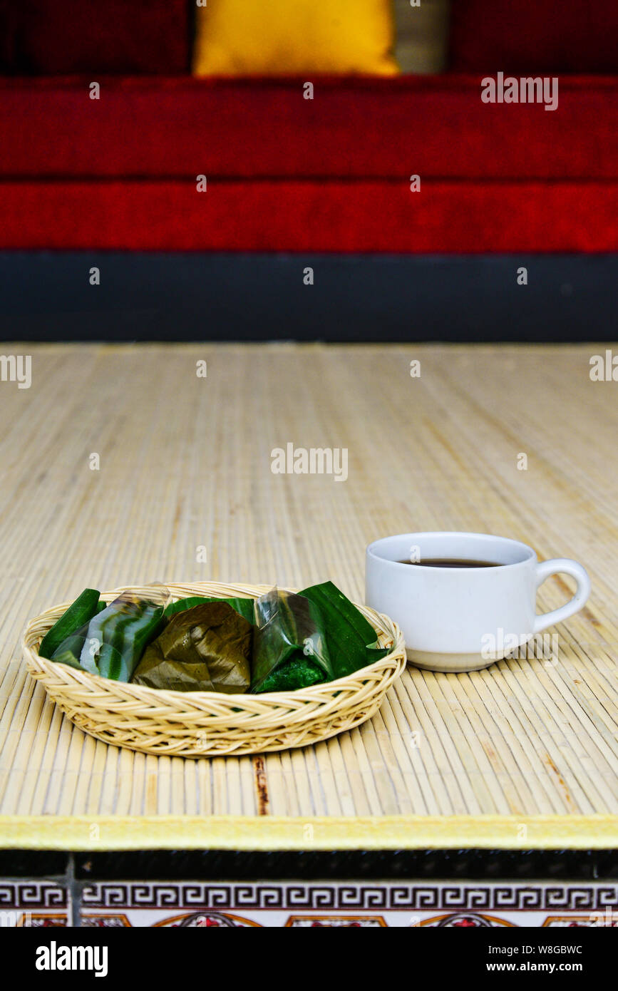 Authentic Bali sweets from rice flour with cup of tea Stock Photo - Alamy