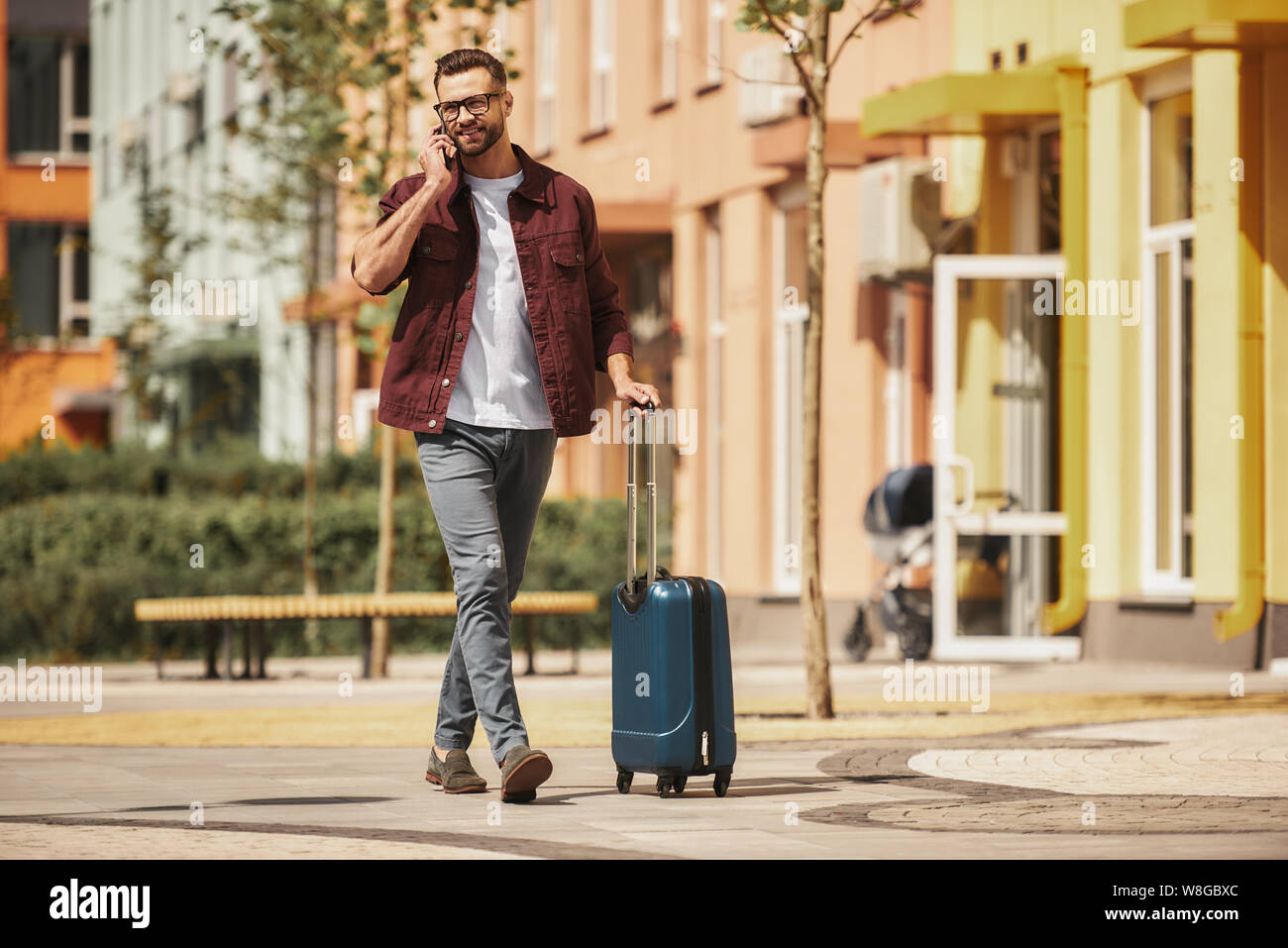 Man pulling suitcase street High Resolution Stock Photography and ...