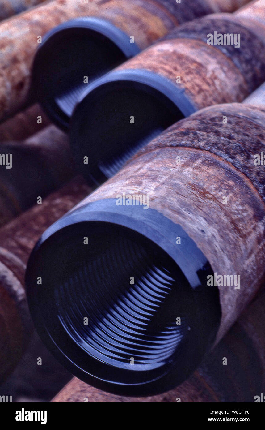 Oil well drilling pipe at the well site Stock Photo - Alamy