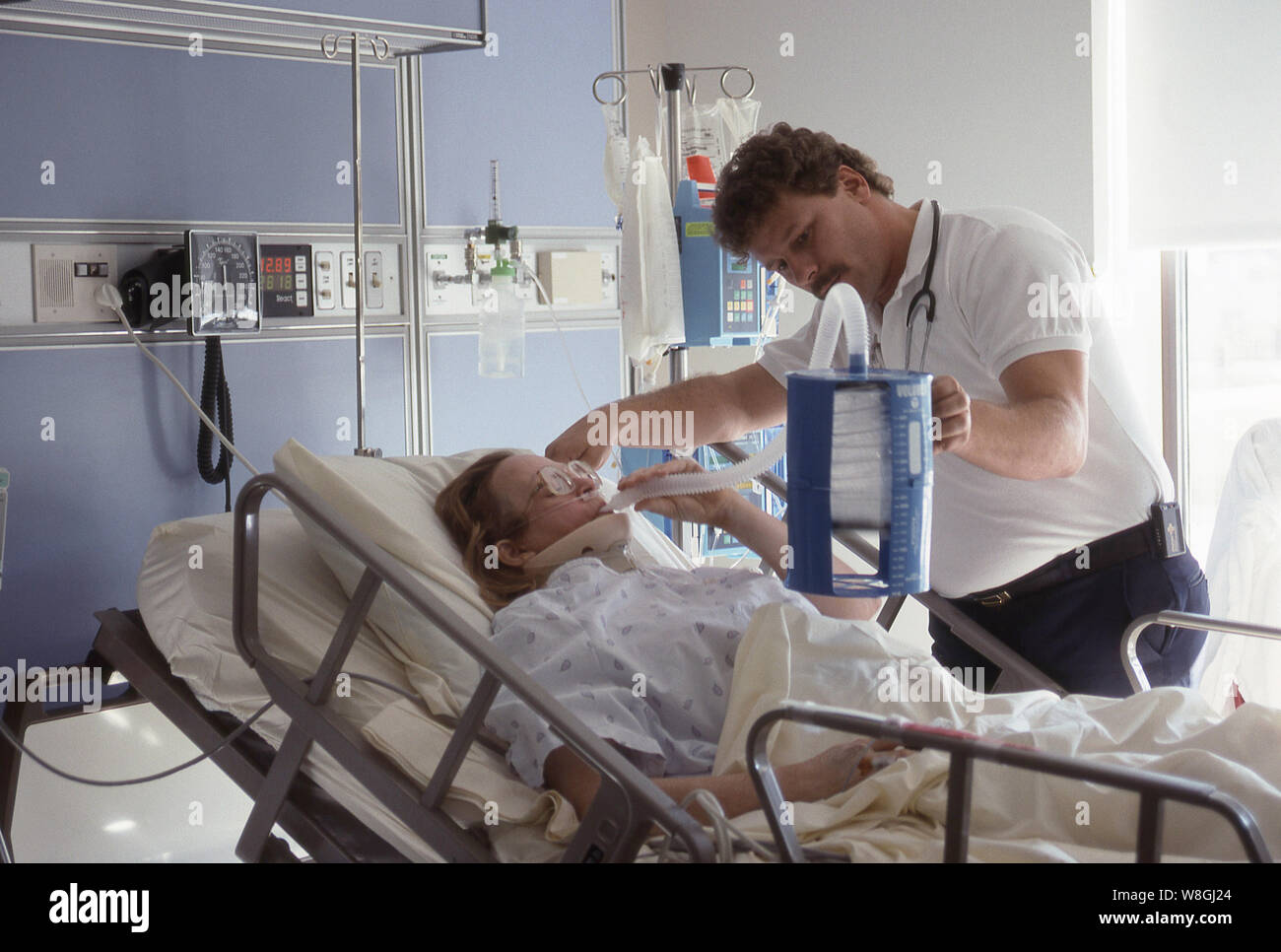 Medical professionals attending to patients Stock Photo - Alamy