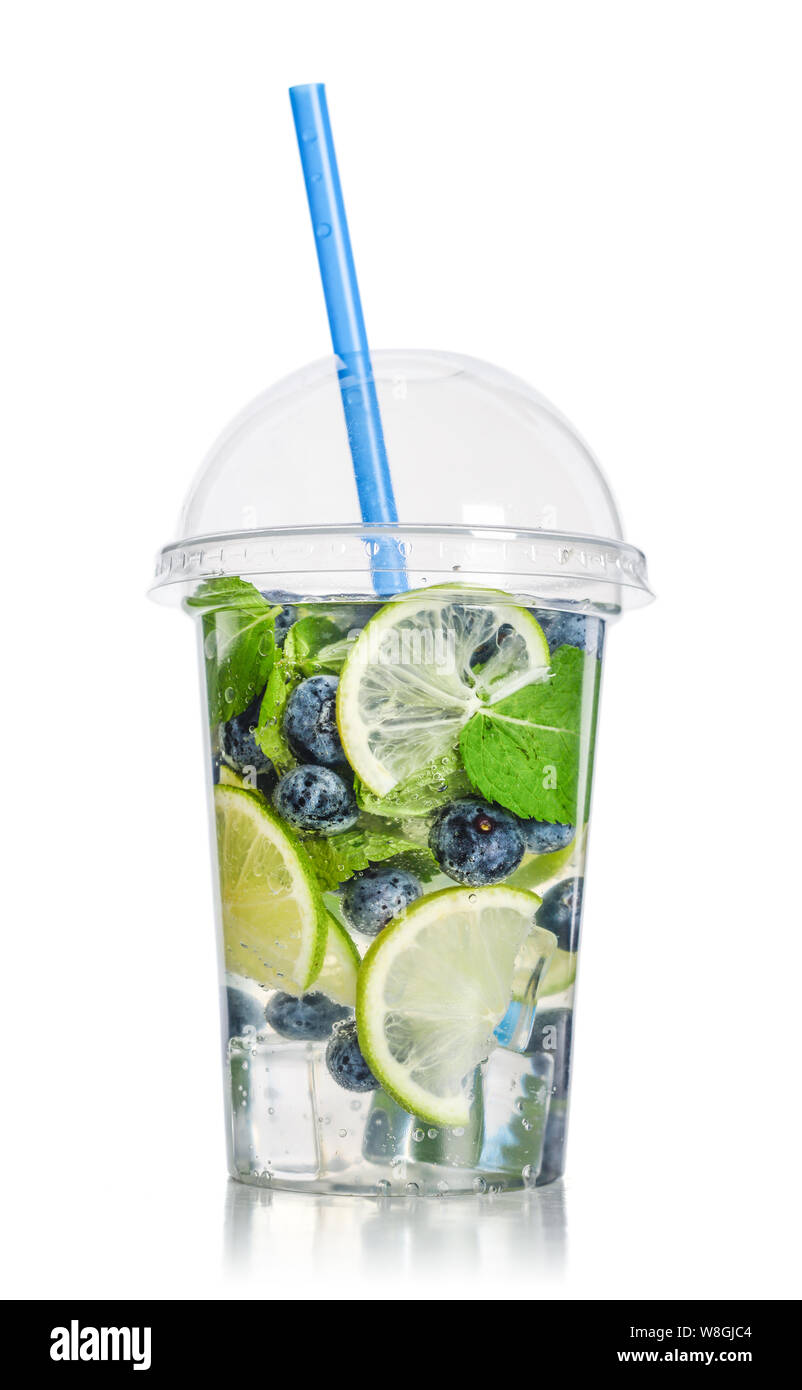 Lemonade with lime, blueberry and mint in a plastic cup with drink ...