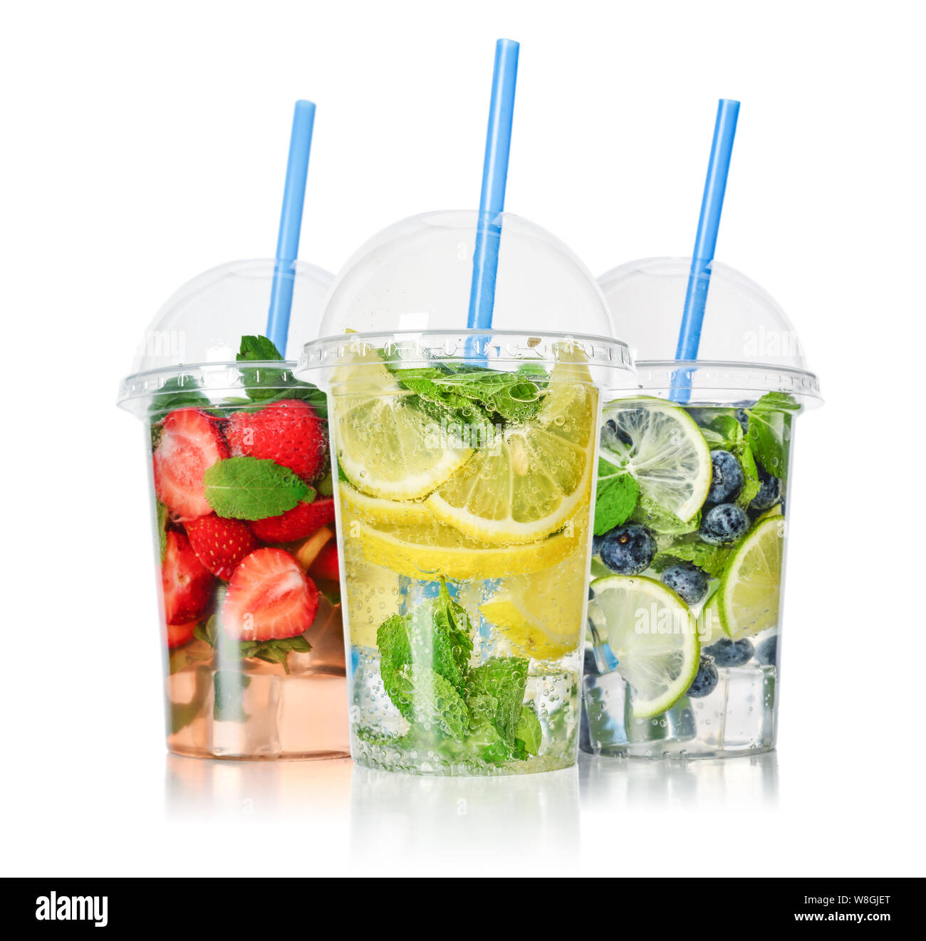 Various lemonade with fruits and berries in a plastic cups with drink ...
