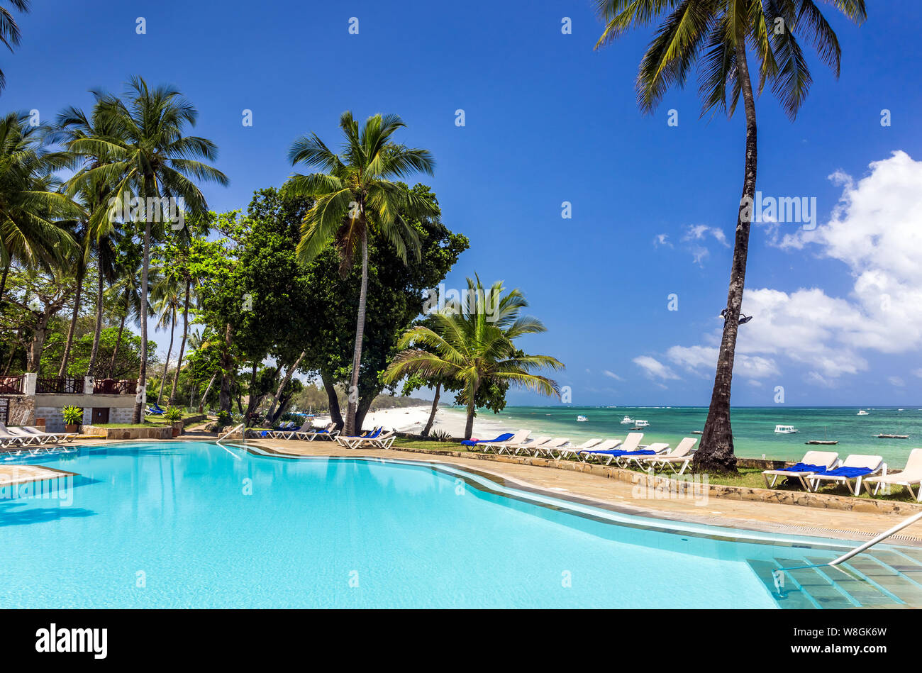 Swimming pool of luxurious african resort and Diani beach seascape in ...