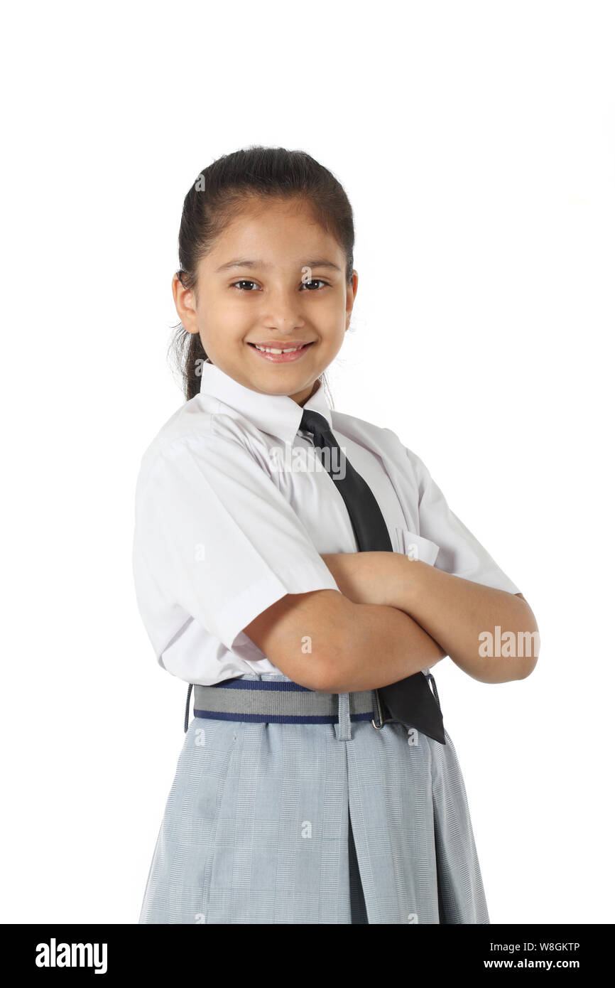 School girl standing with arms crossed Stock Photo - Alamy