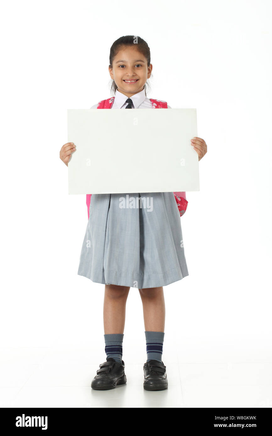 Schoolgirl holding a blank placard Stock Photo - Alamy