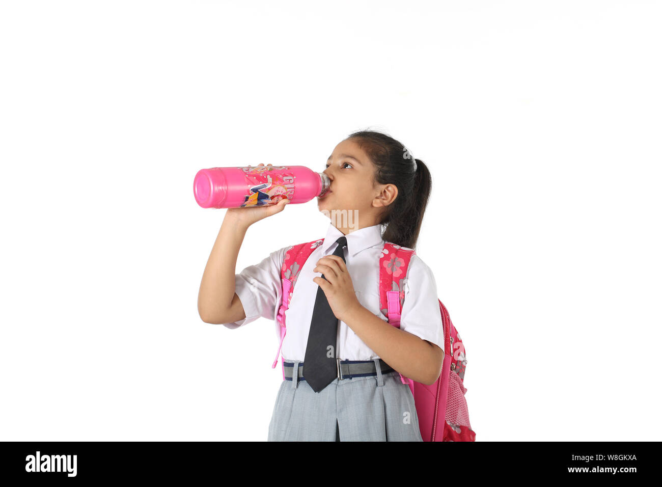Indian school girl drinking water hi-res stock photography and images - Alamy