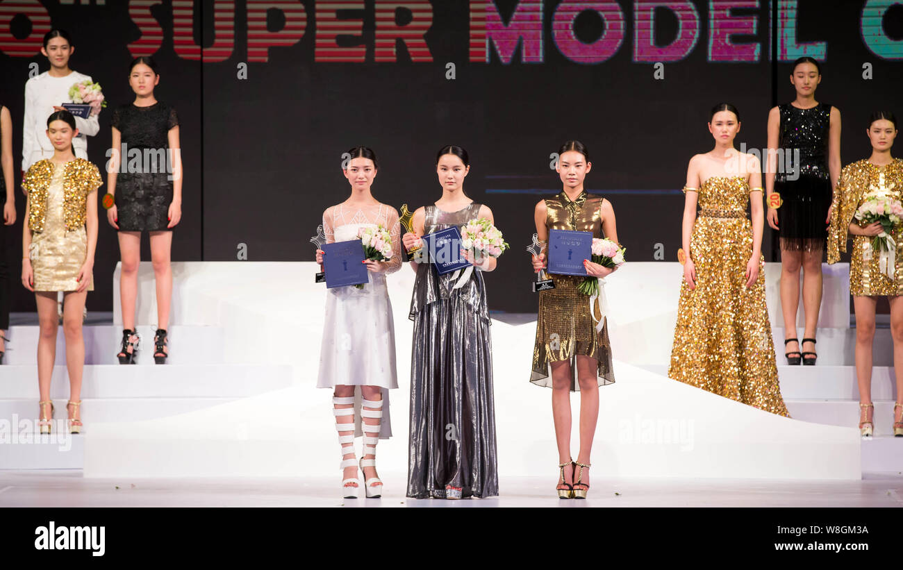 (From left) Third winner Xu Naiyu, champion Wang Yi and second winner ...