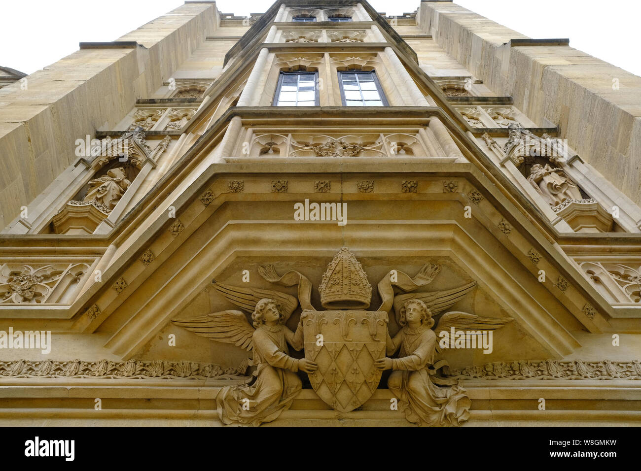 The Magdalen College crest on St Swithun's Tower Stock Photo - Alamy