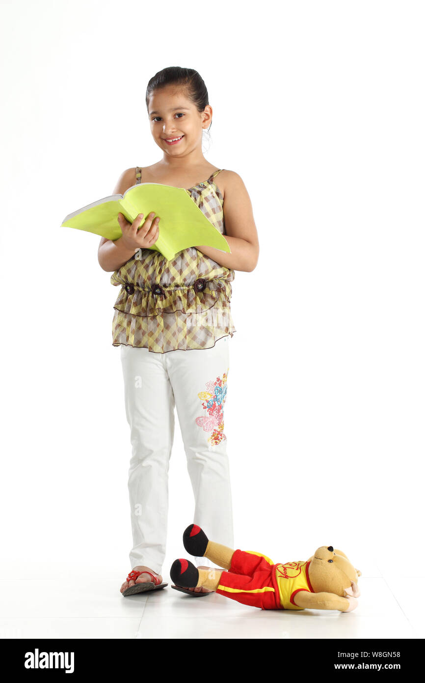 Girl reading a notebook Stock Photo - Alamy