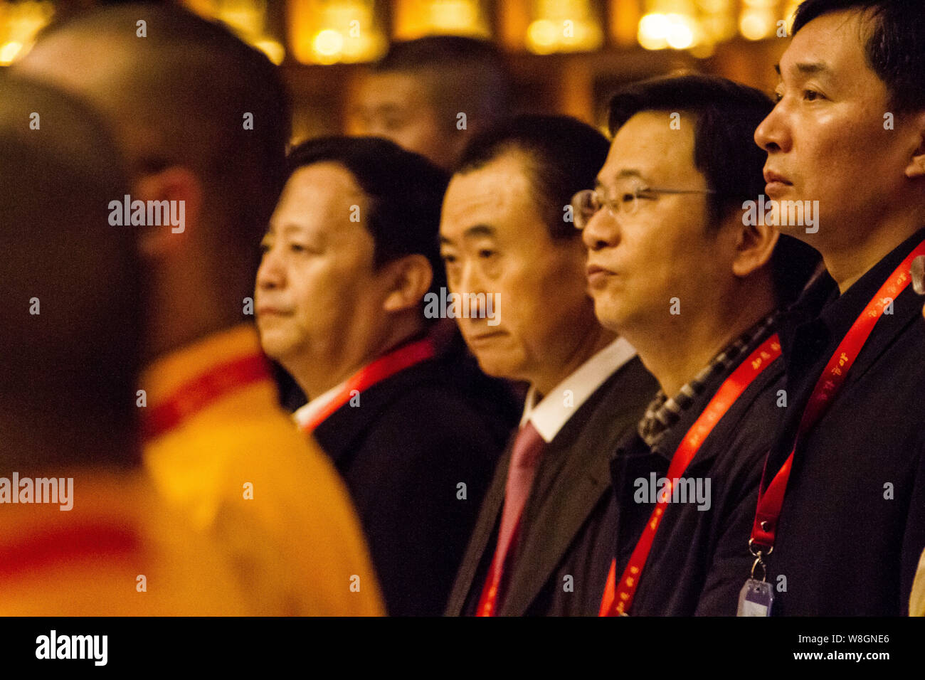 Wang Jianlin, center, Chairman of Dalian Wanda Group, attends the ...