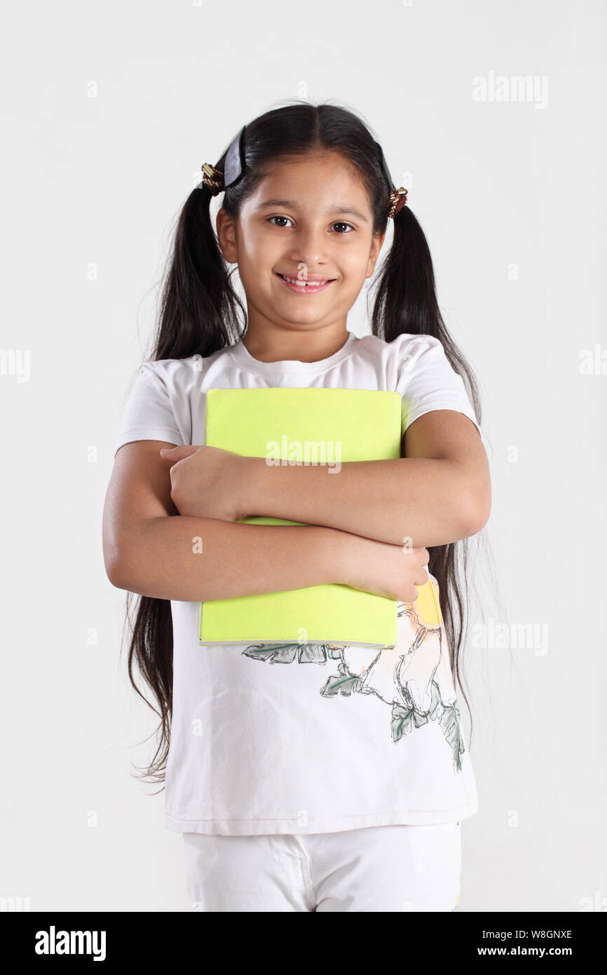 Child hugging book hi-res stock photography and images - Alamy