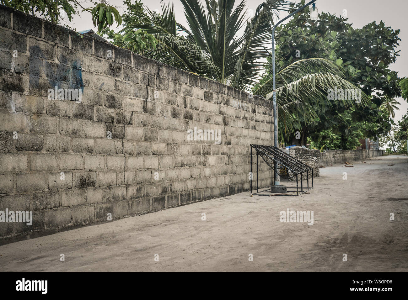 Empty street in traditional Maldivian village on Fehendhoo island, Baa ...