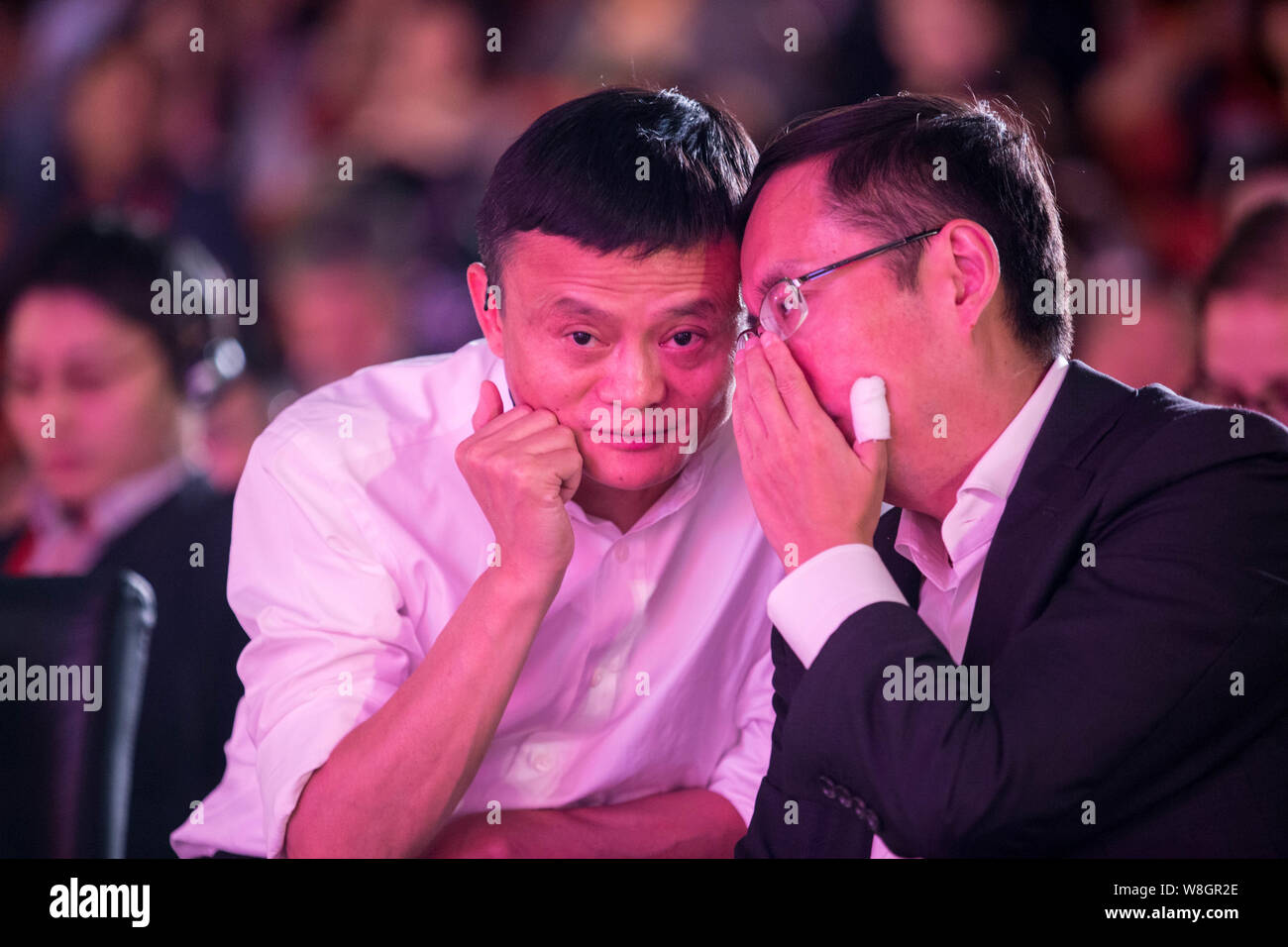 Zhang Yong, right, CEO of Alibaba Group, speaks to Jack Ma Yun ...