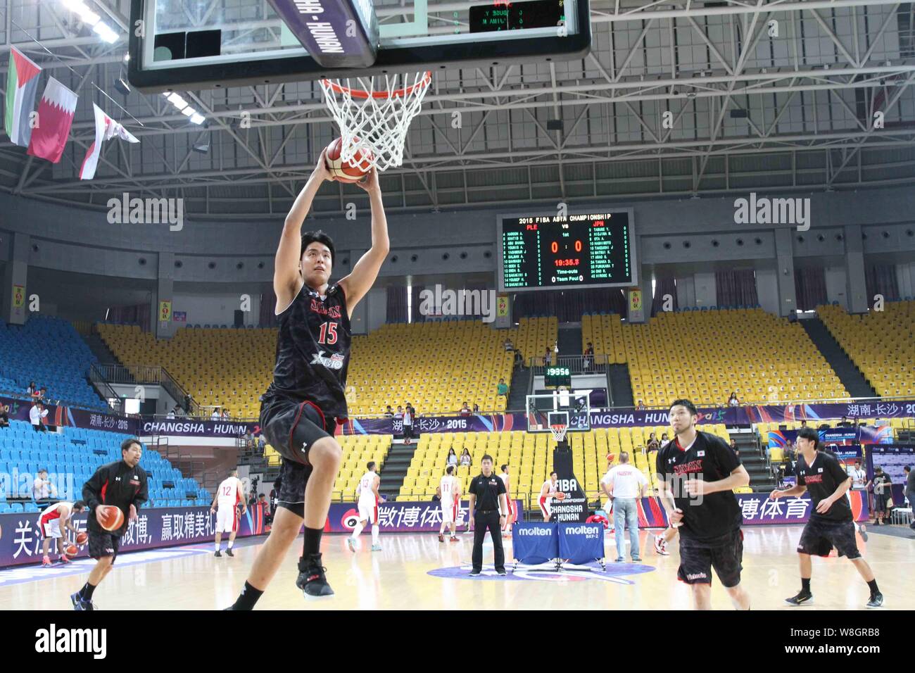 Joji Takeuchi of Japan dunks in a training session before a second ...