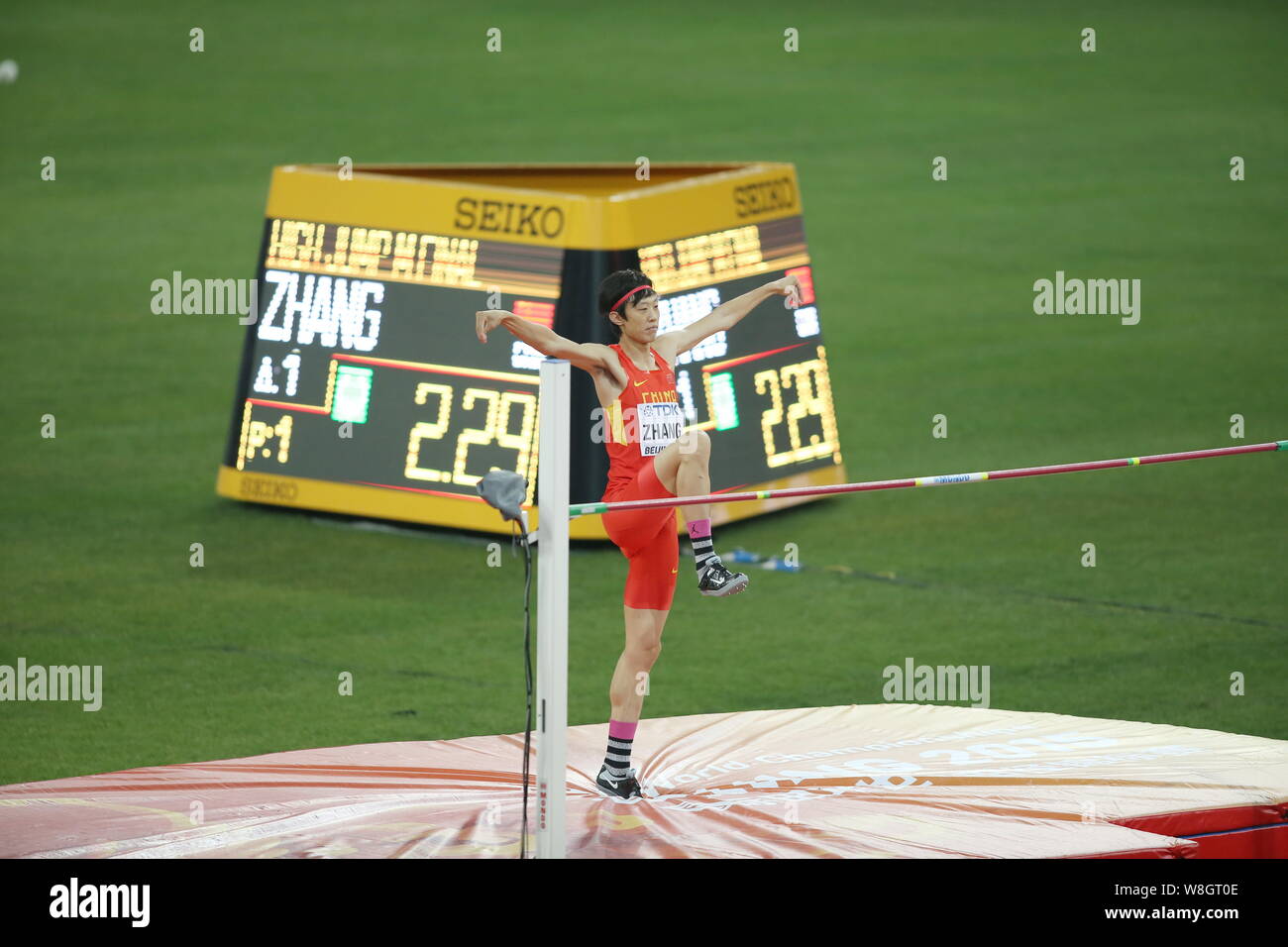 China's Zhang Guowei reacts after clearing the bar in the men's high ...