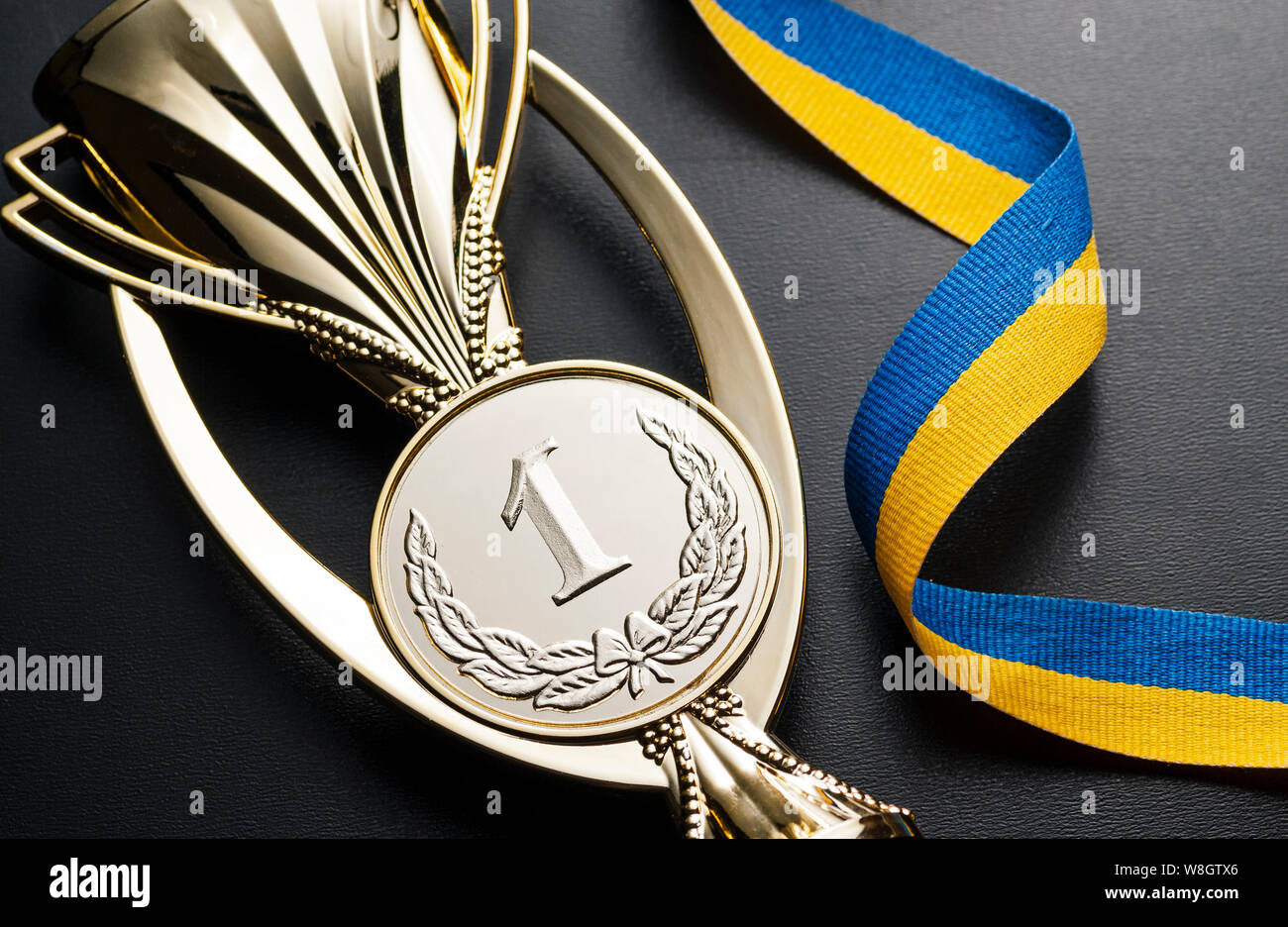 Gold winners medal for a competition, championship or race with a ...